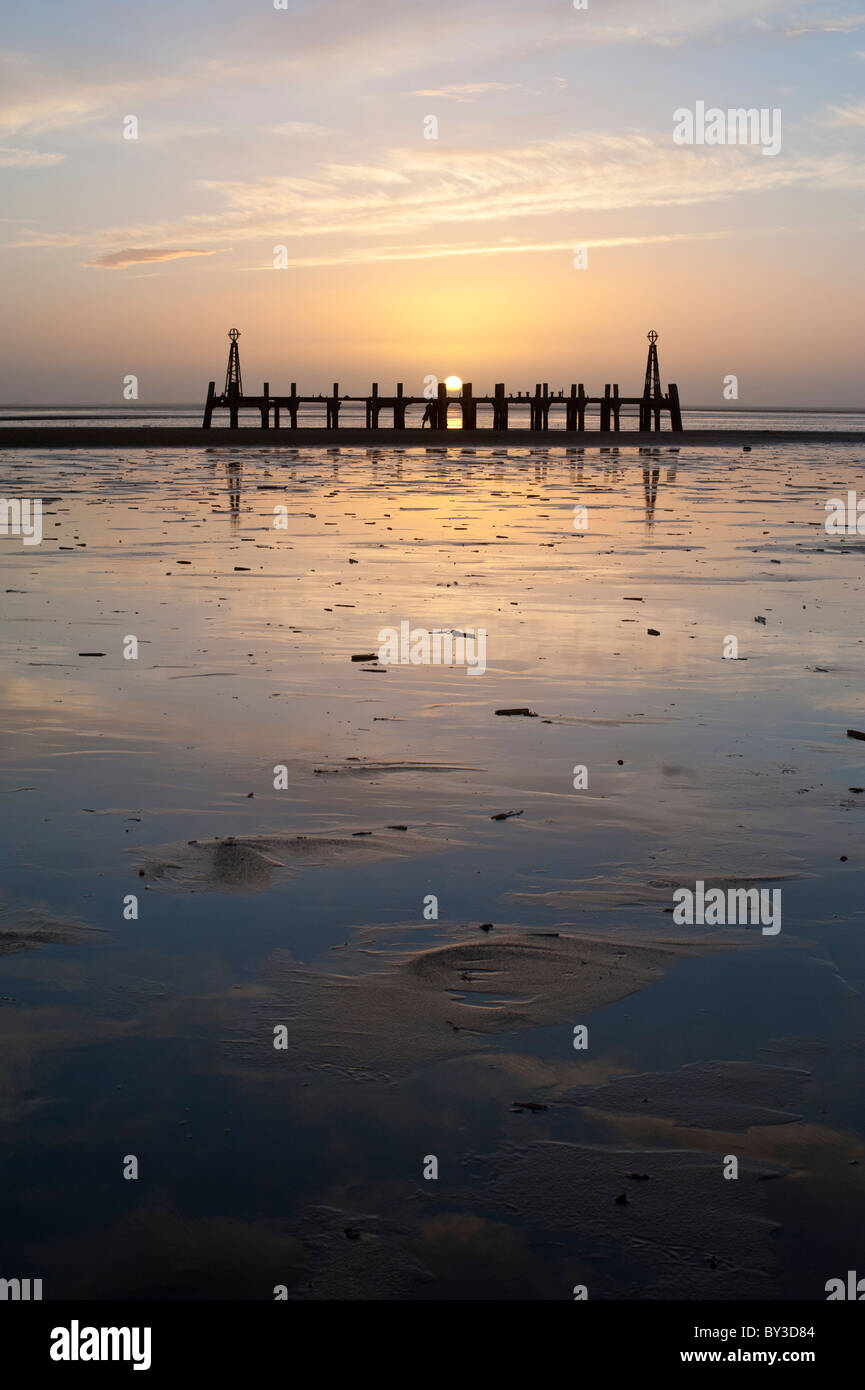 The sun setting across the Ribble Estuary viewed from Lytham St Annes ...
