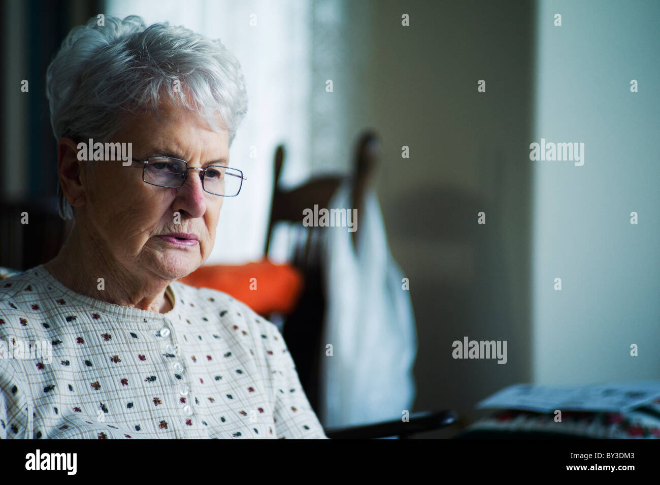 Old woman with concerned expression Stock Photo - Alamy