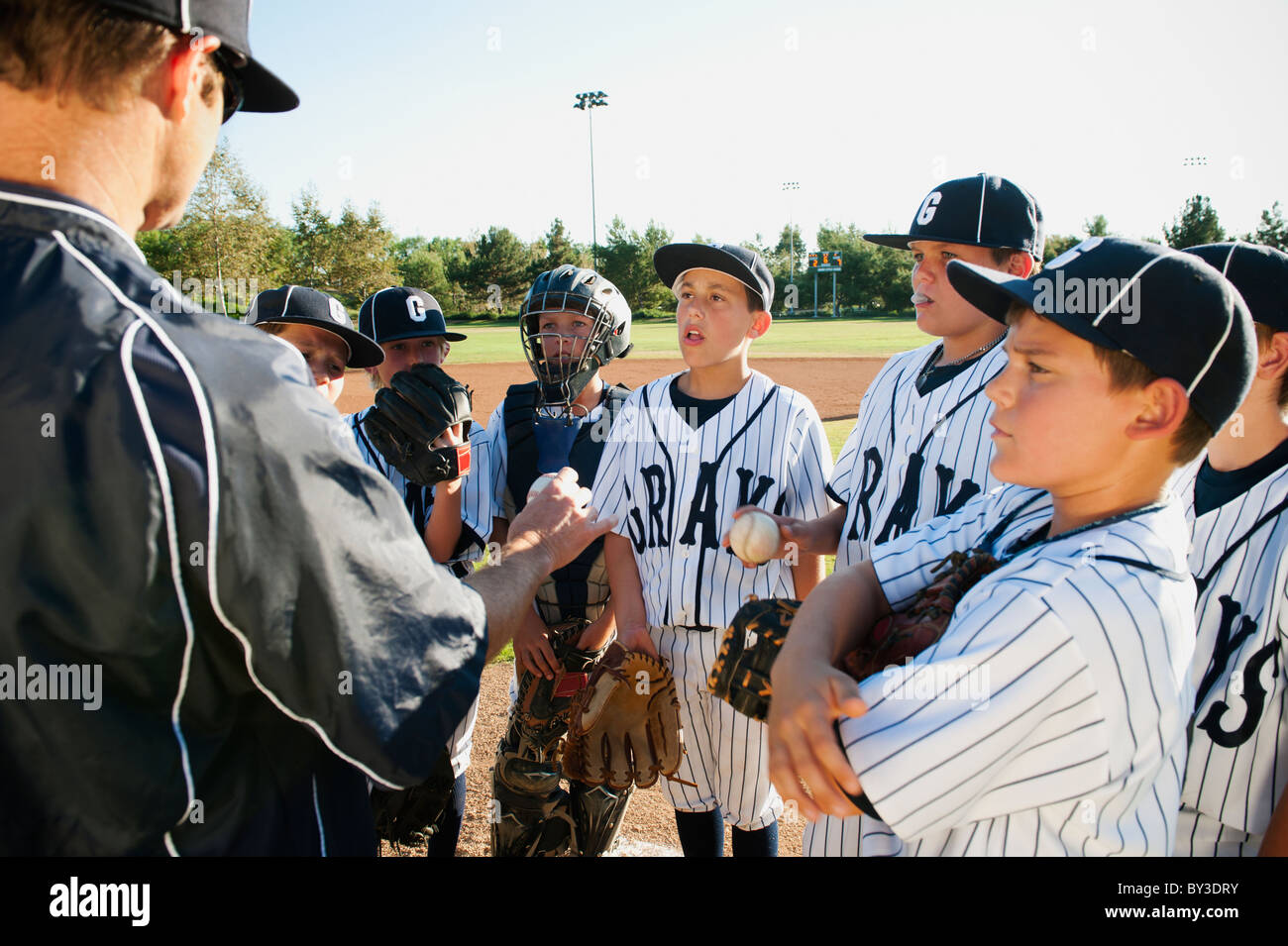USA, California, Ladera Ranch, coach training little league baseball ...