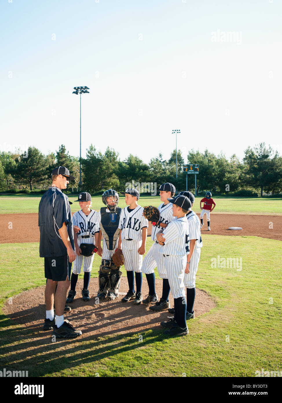 USA, California, Ladera Ranch, coach training little league baseball ...