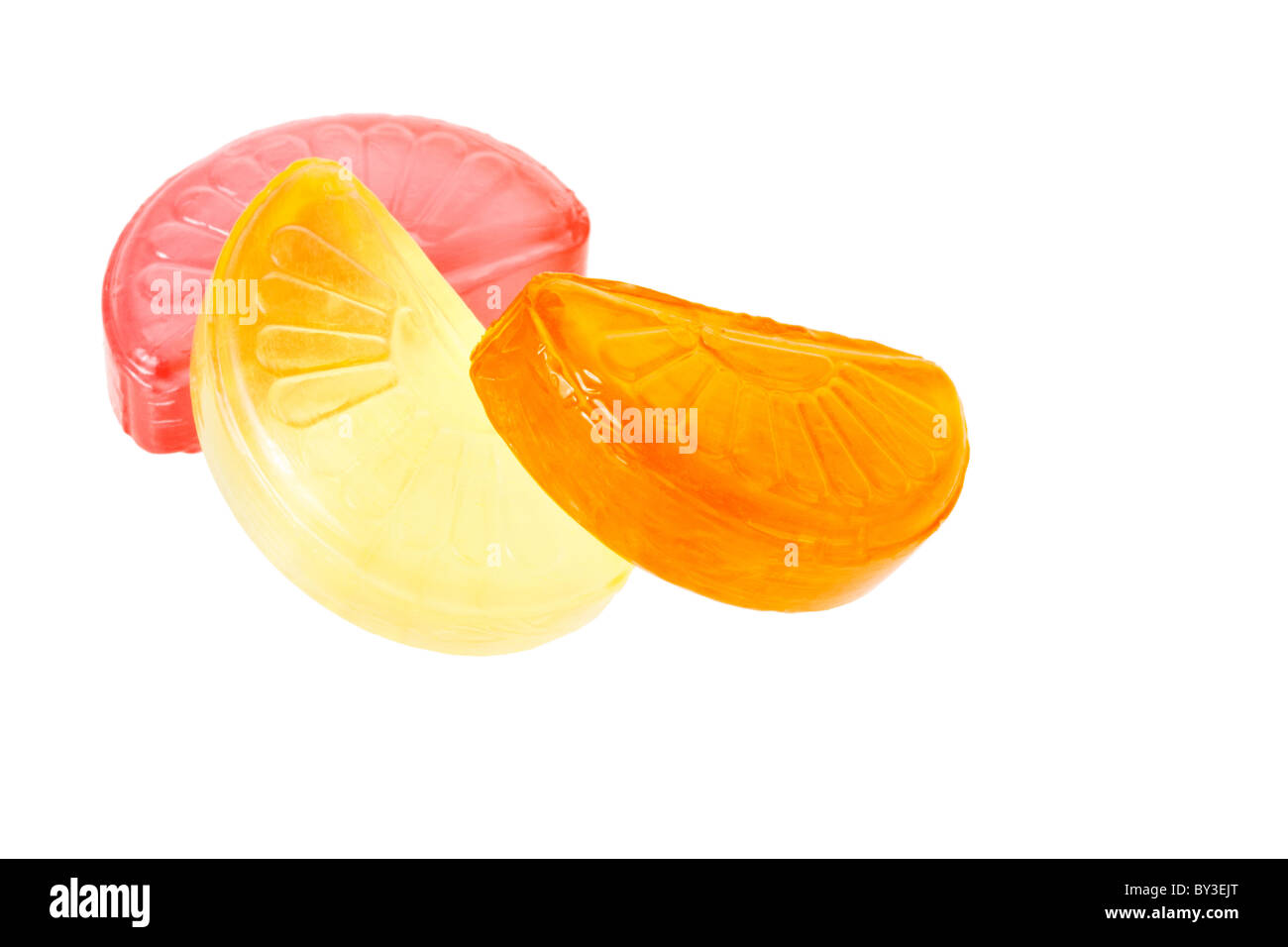 Fruit drop lemon, orange and grapefruit sections isolated on white ...