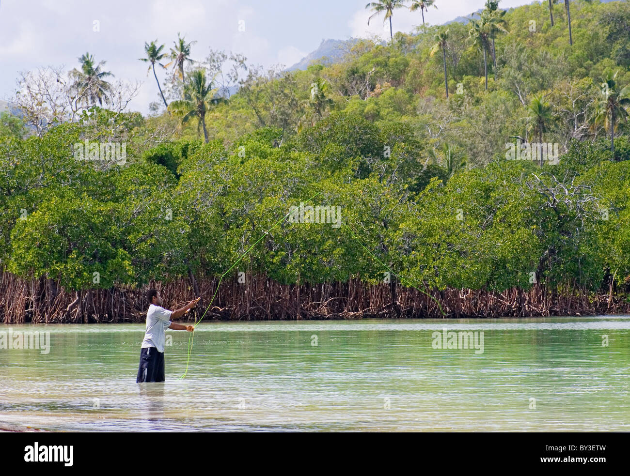 Fjian Man fly-fishing from a beach on a small Fijian island Stock Photo ...