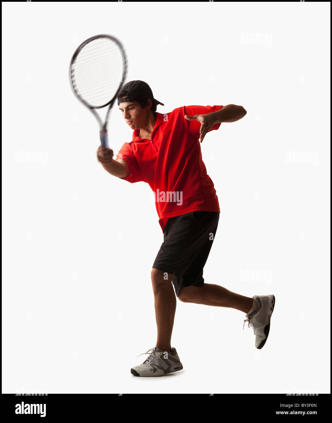 Young man playing tennis Stock Photo - Alamy