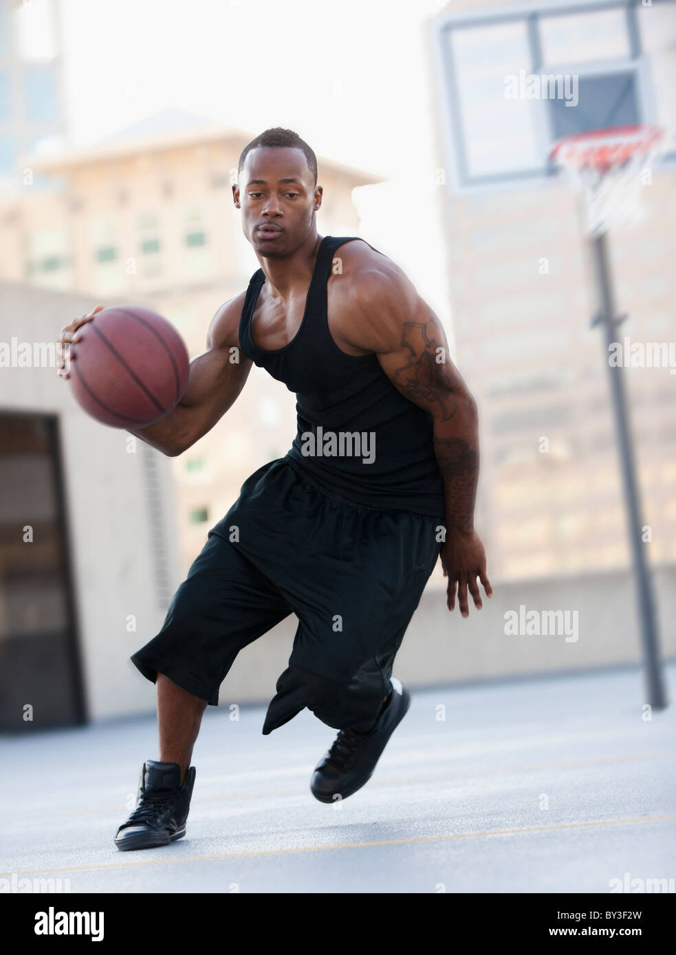 Playing basketball hoop action building exterior hi-res stock ...