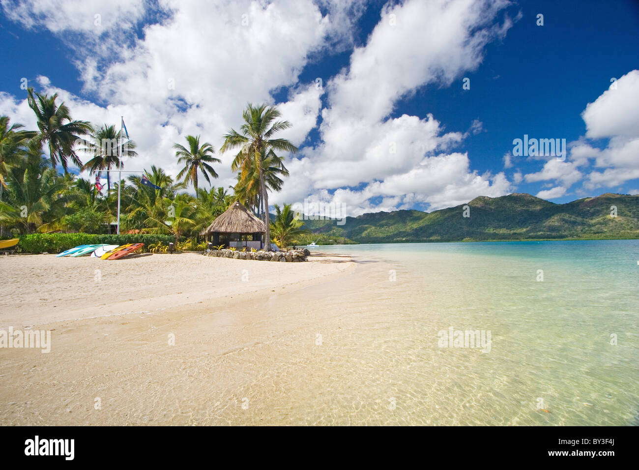 Beautiful clear water and a white sandy beach in Fiji around a tropical ...