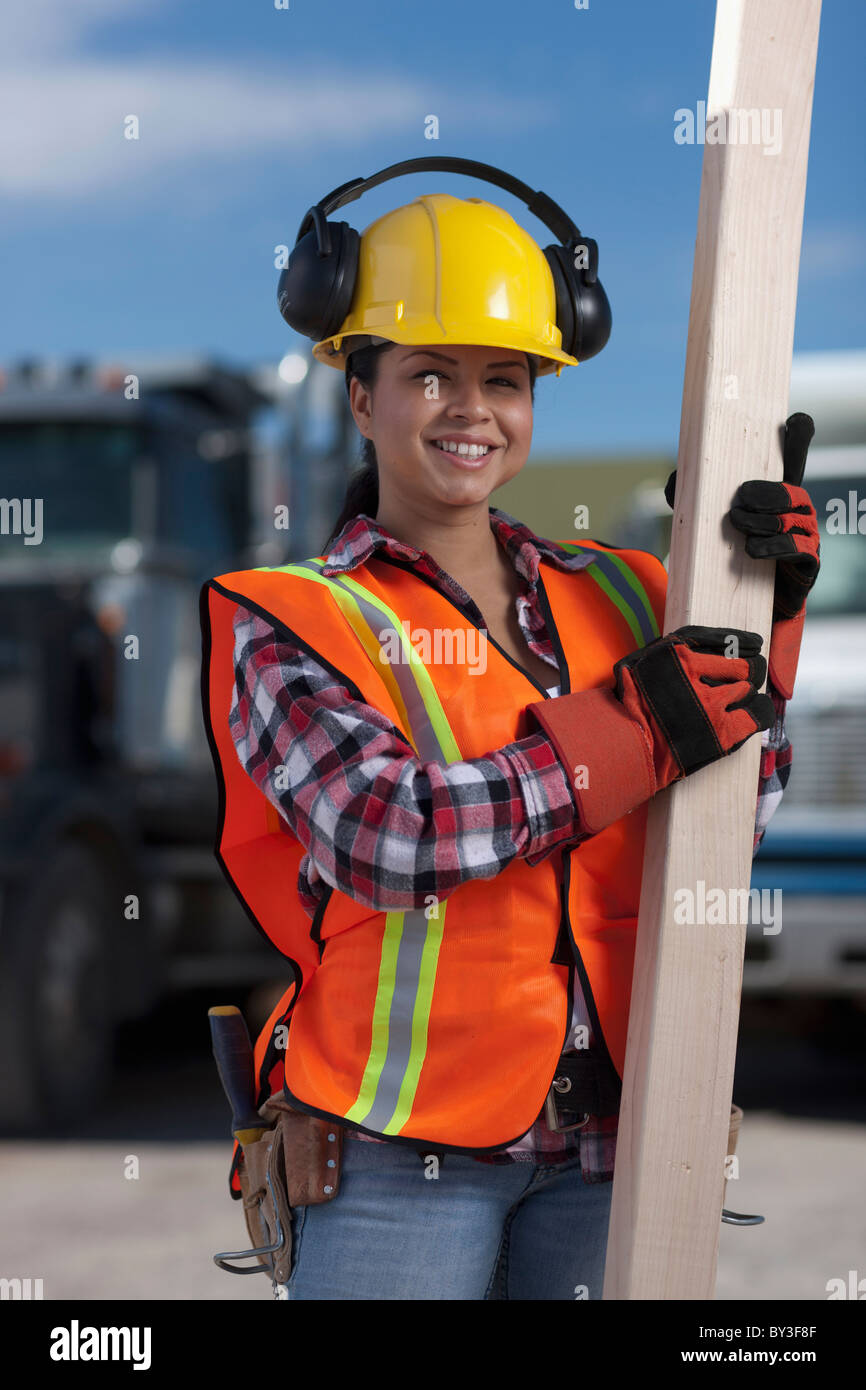 Portrait of female construction worker on building site Stock Photo - Alamy