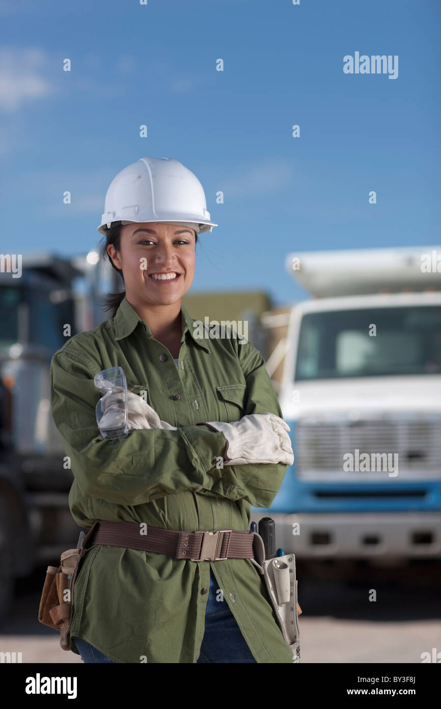 Portrait of female construction worker on building site Stock Photo - Alamy