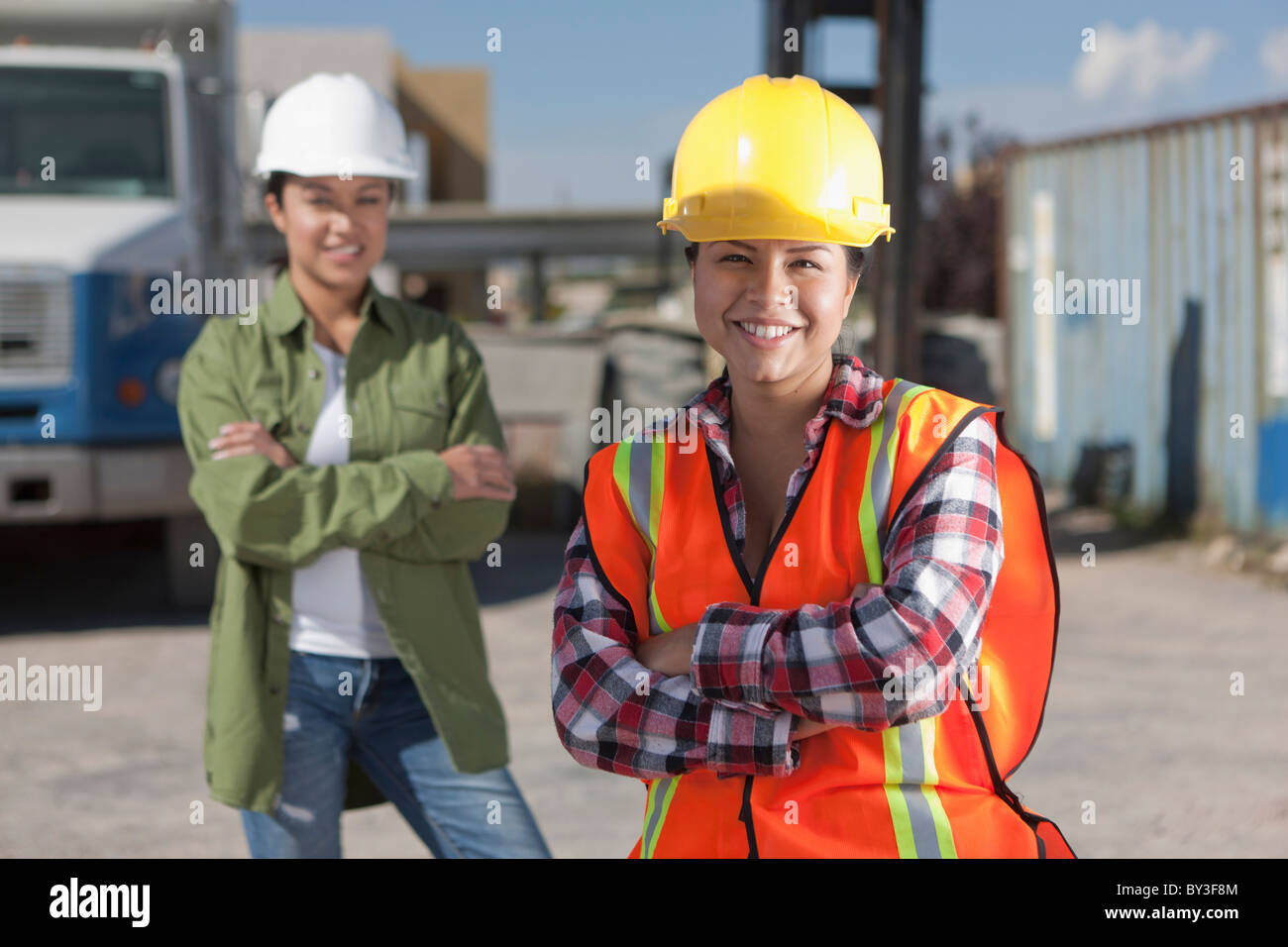 Portrait of two female construction workers on building site Stock ...