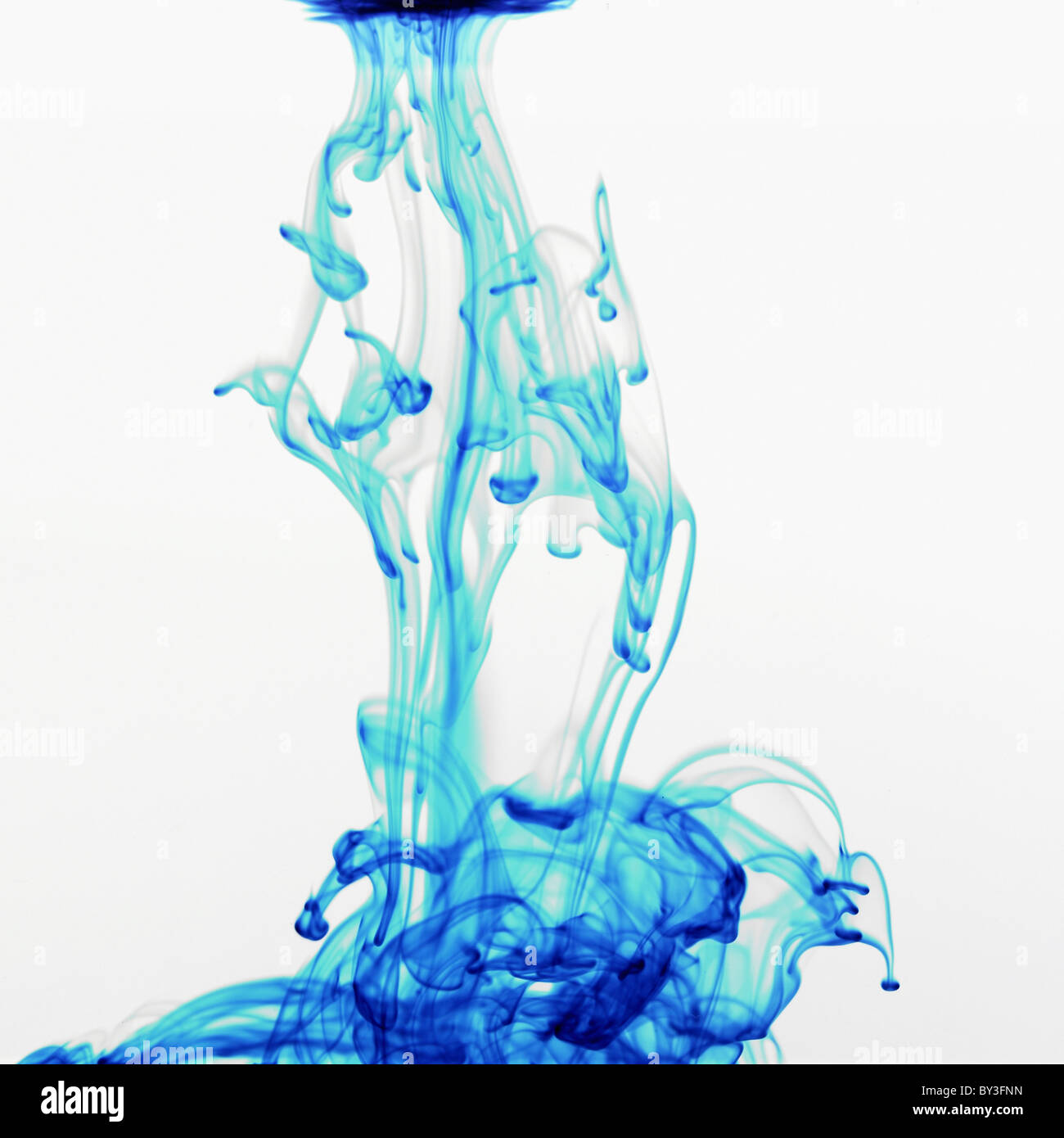 Studio shot of blue dye in abstract shape Stock Photo - Alamy