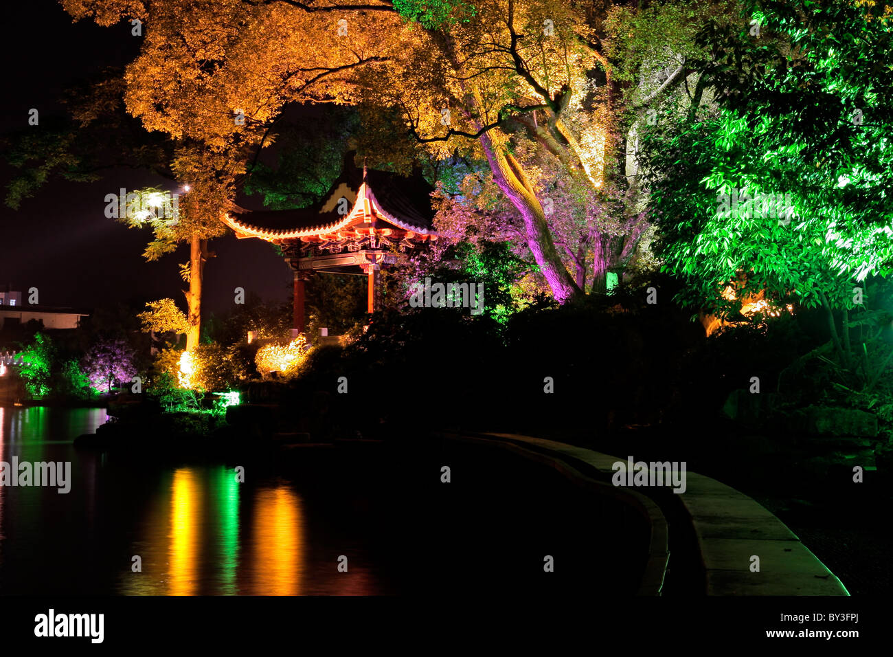 Night scene with a colorfully lit tree in a park, Guilin, China Stock ...