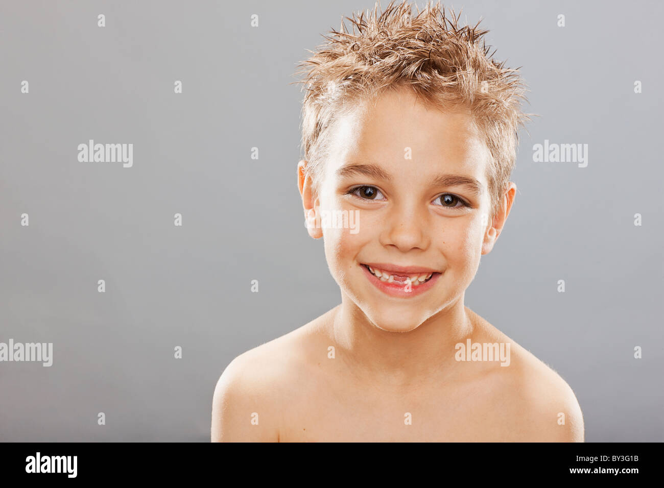 Studio portrait of toothless boy (8-9) smiling Stock Photo - Alamy