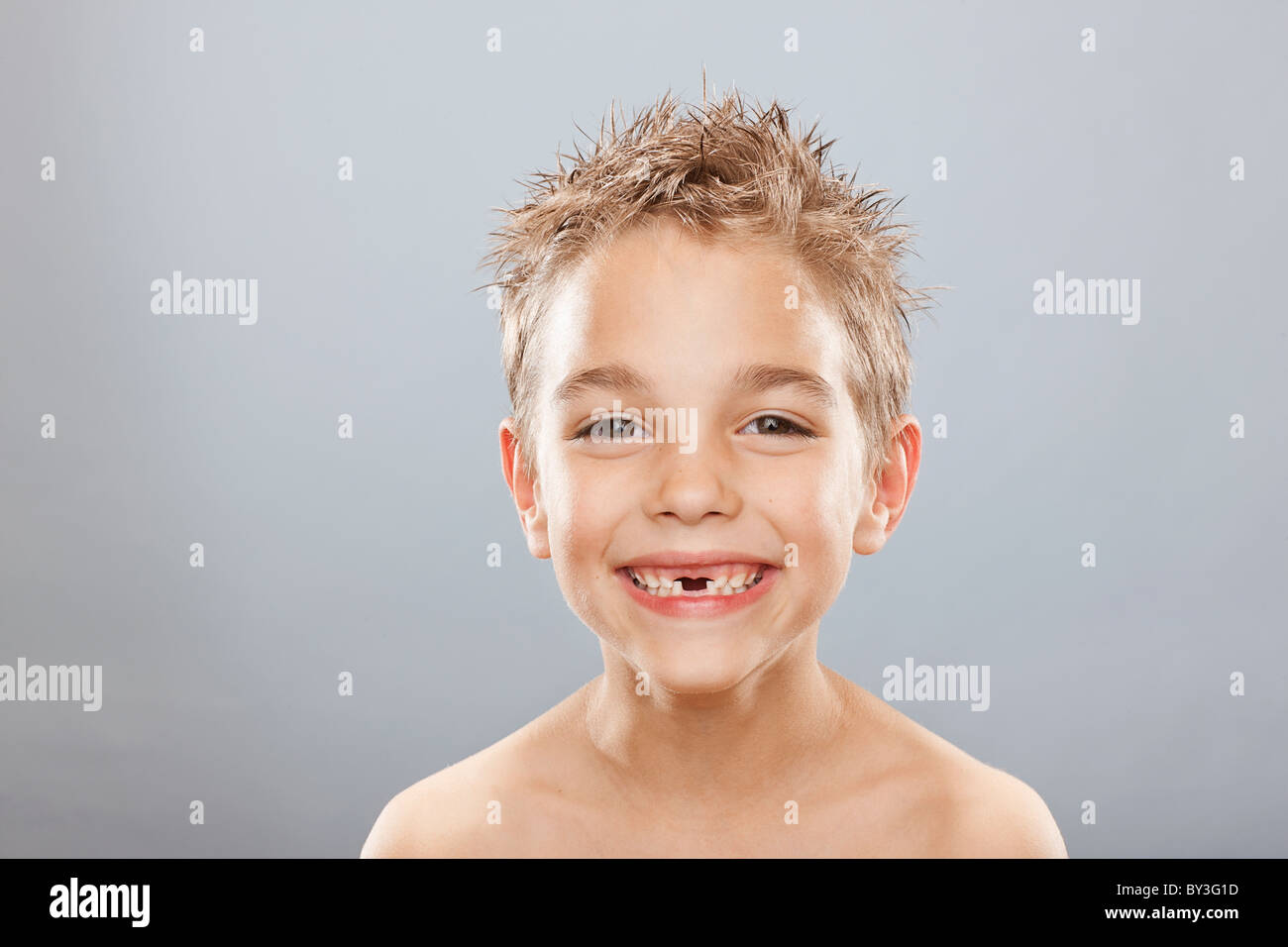 Studio portrait of toothless boy (8-9) smiling Stock Photo - Alamy