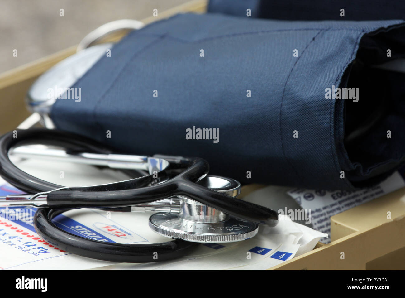 A blood pressure guage tool in a first aid box Stock Photo - Alamy