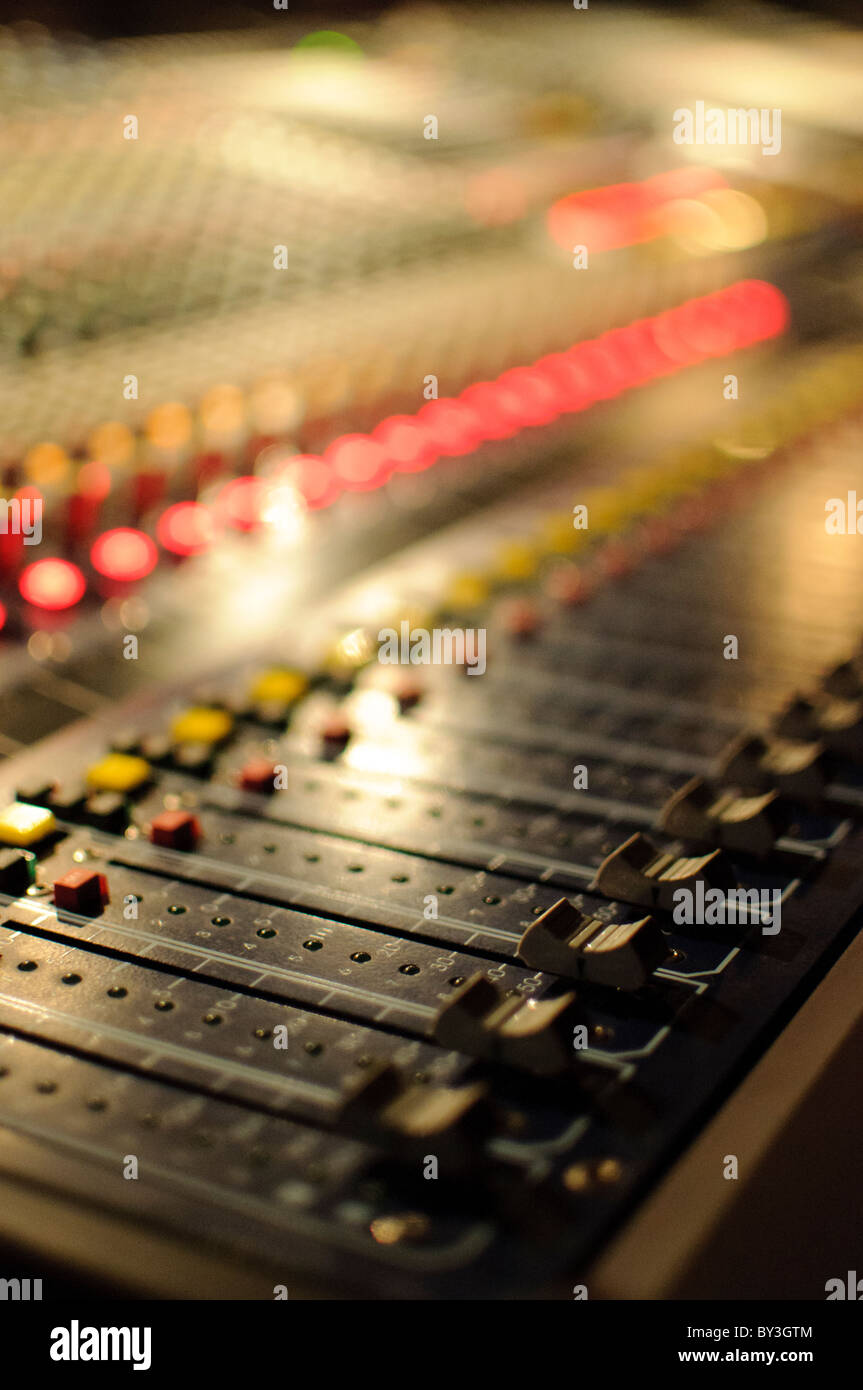 Sliders on a sound mixing board Stock Photo - Alamy