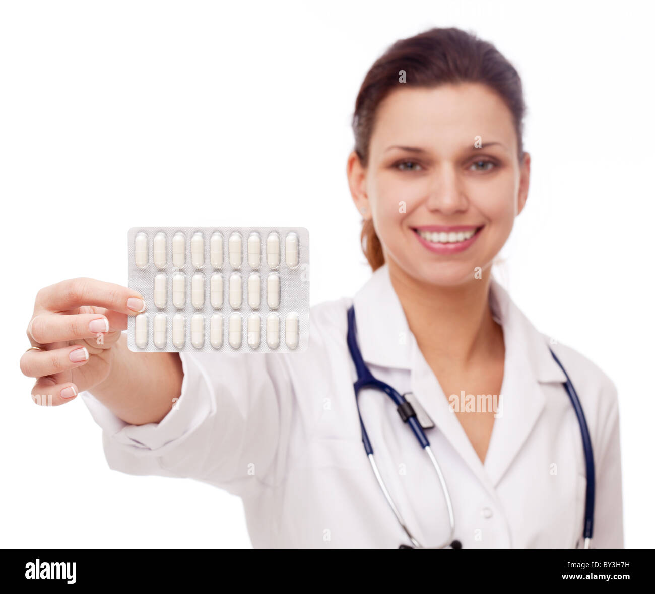 Doctor giving a pill. Hand with pills is front plan Stock Photo - Alamy