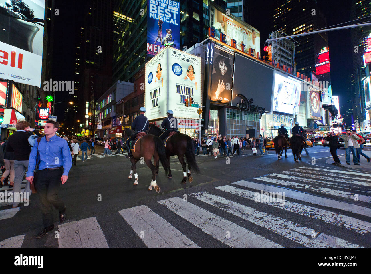 U.S.A., New York, Manhattan, policemen and neon sign in Times Square ...