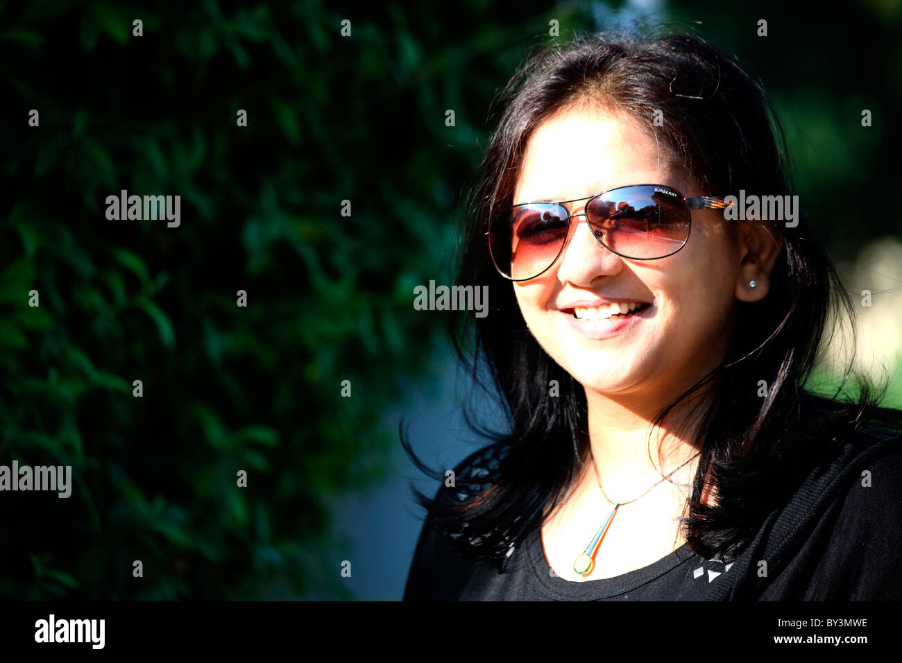 A smiling indian lady Stock Photo - Alamy