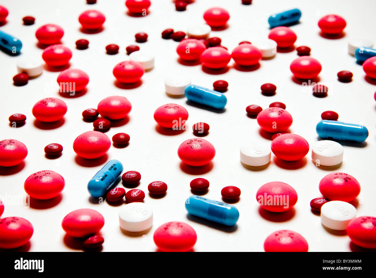 Scattered prescription drugs on a white background Stock Photo - Alamy