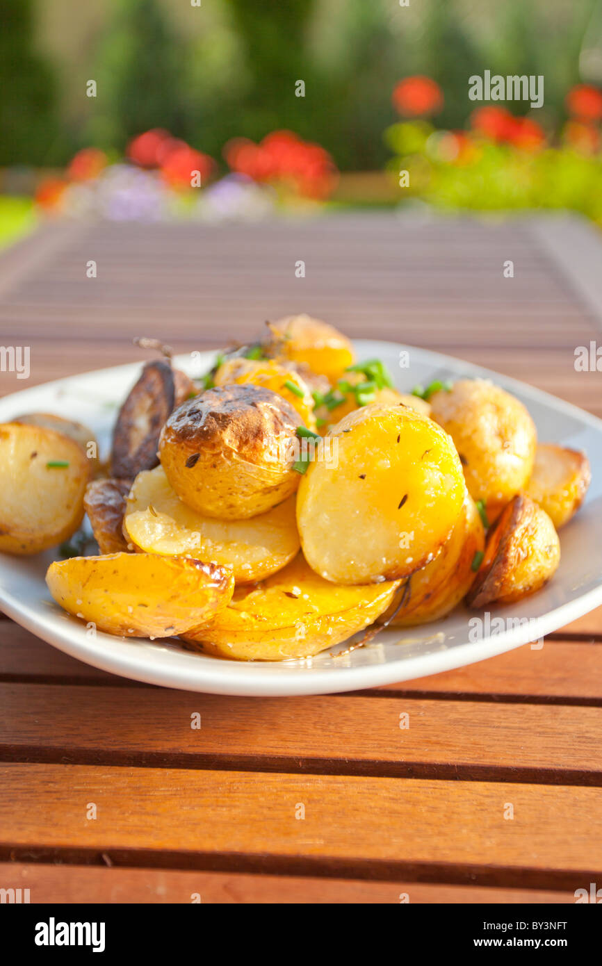 Roasted potatoes on a plate Stock Photo - Alamy