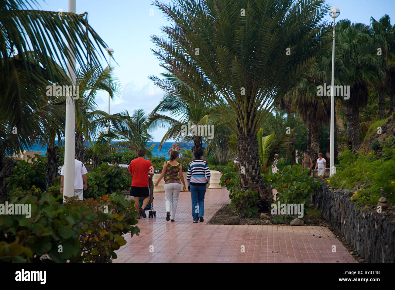 Tourists walking on the promenade of Costa Adeje, Tenerife, Canary Islands, Spain Stock Photo ...
