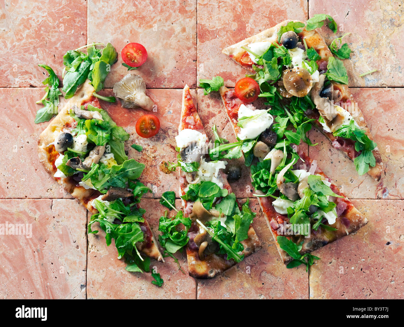 Parts of spliced pizza Stock Photo - Alamy