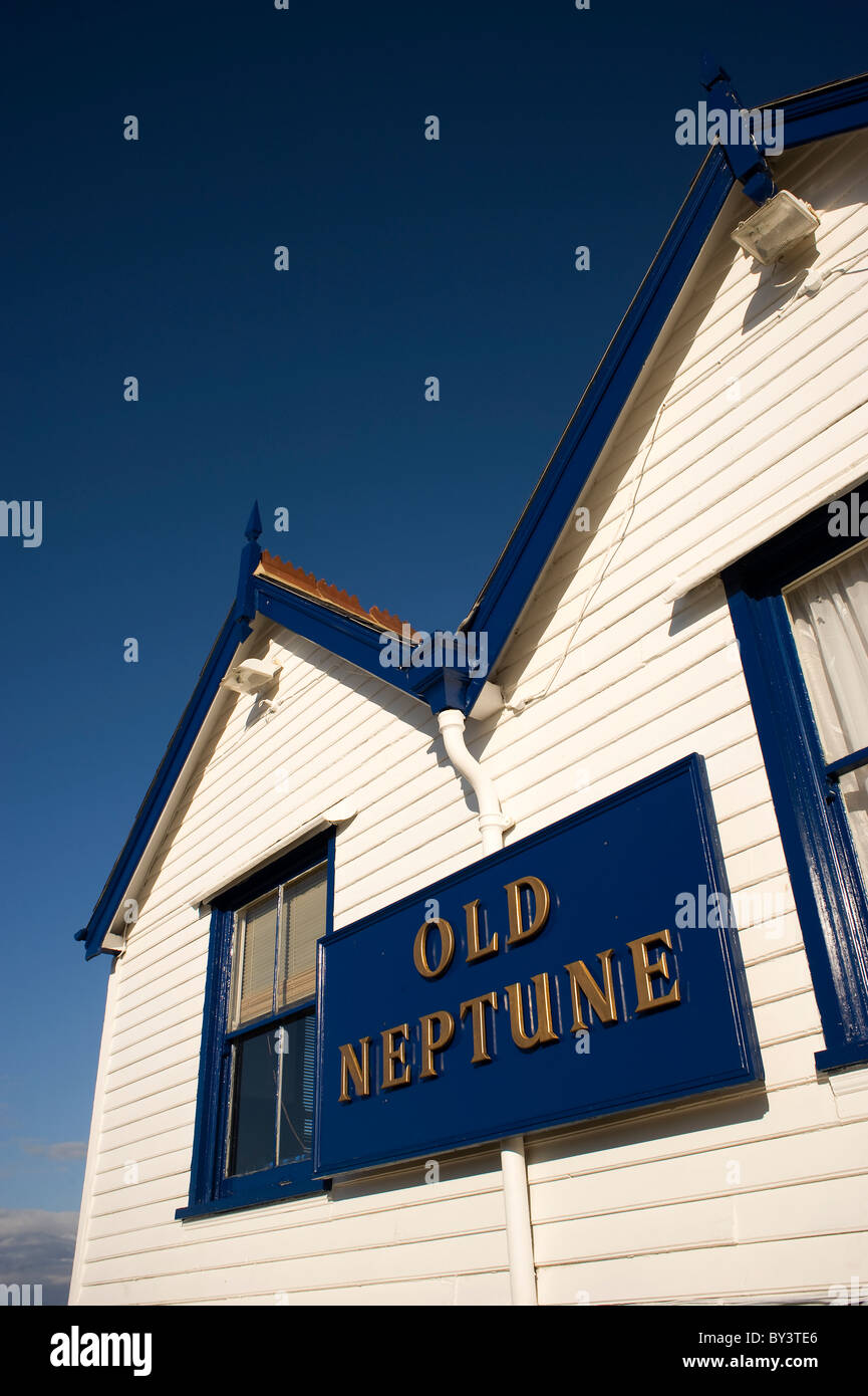 detail of the Neptune Pub sign white wood Stock Photo - Alamy