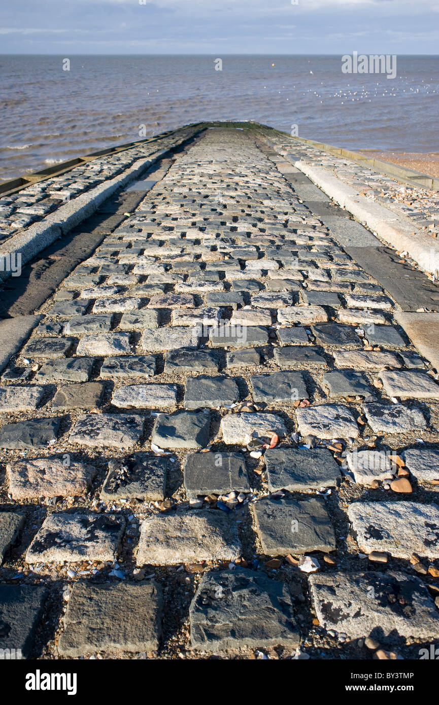 slip way slipway into sea cobble cobbles stone Stock Photo - Alamy