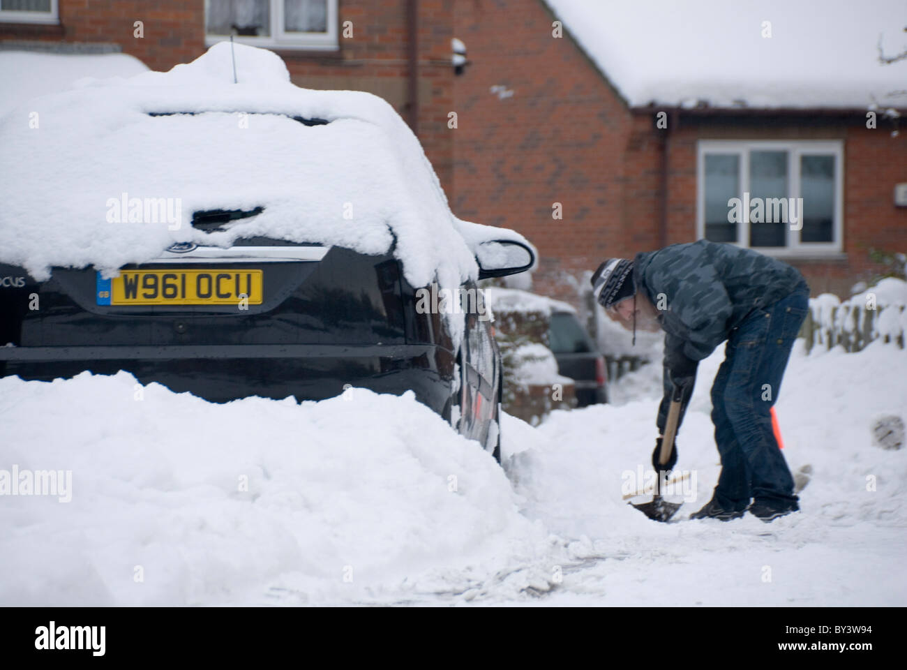 Man Digging Car out of Deep Winter Snow, Winter Driving Problems, Dec ...