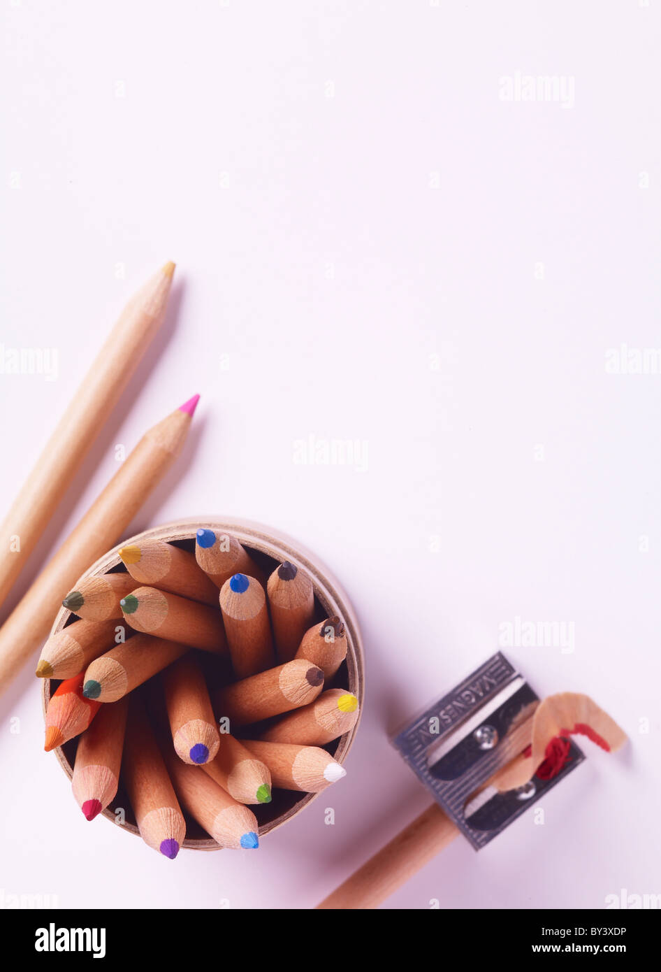 colour pencils coming out of a tube with a pencil sharpener Stock Photo ...