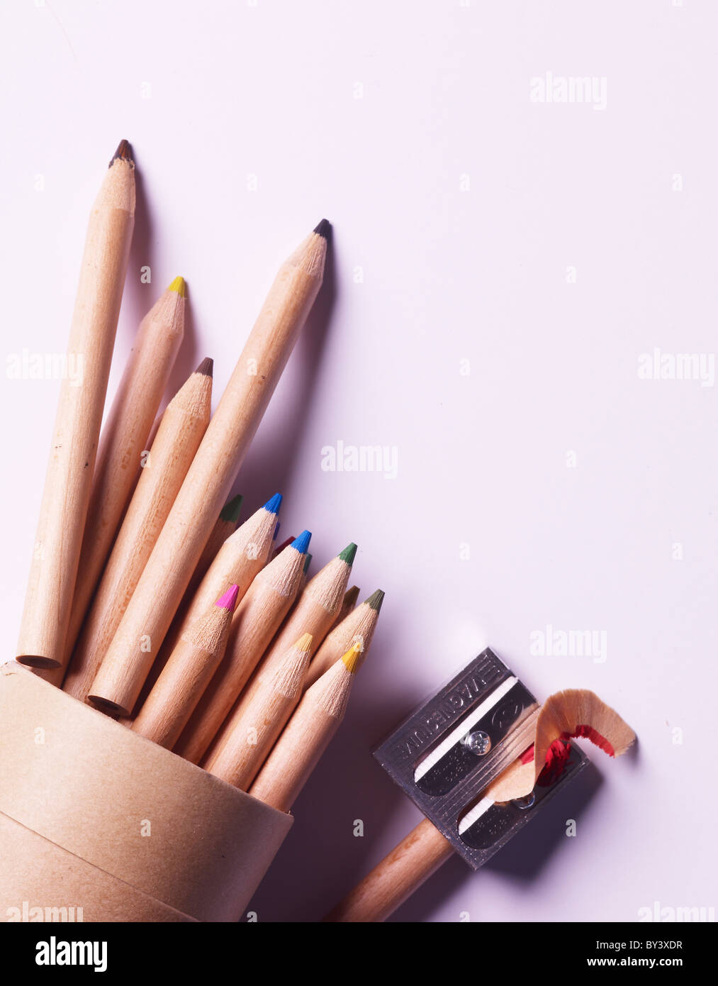 colour pencils coming out of a tube with a pencil sharpener Stock Photo ...