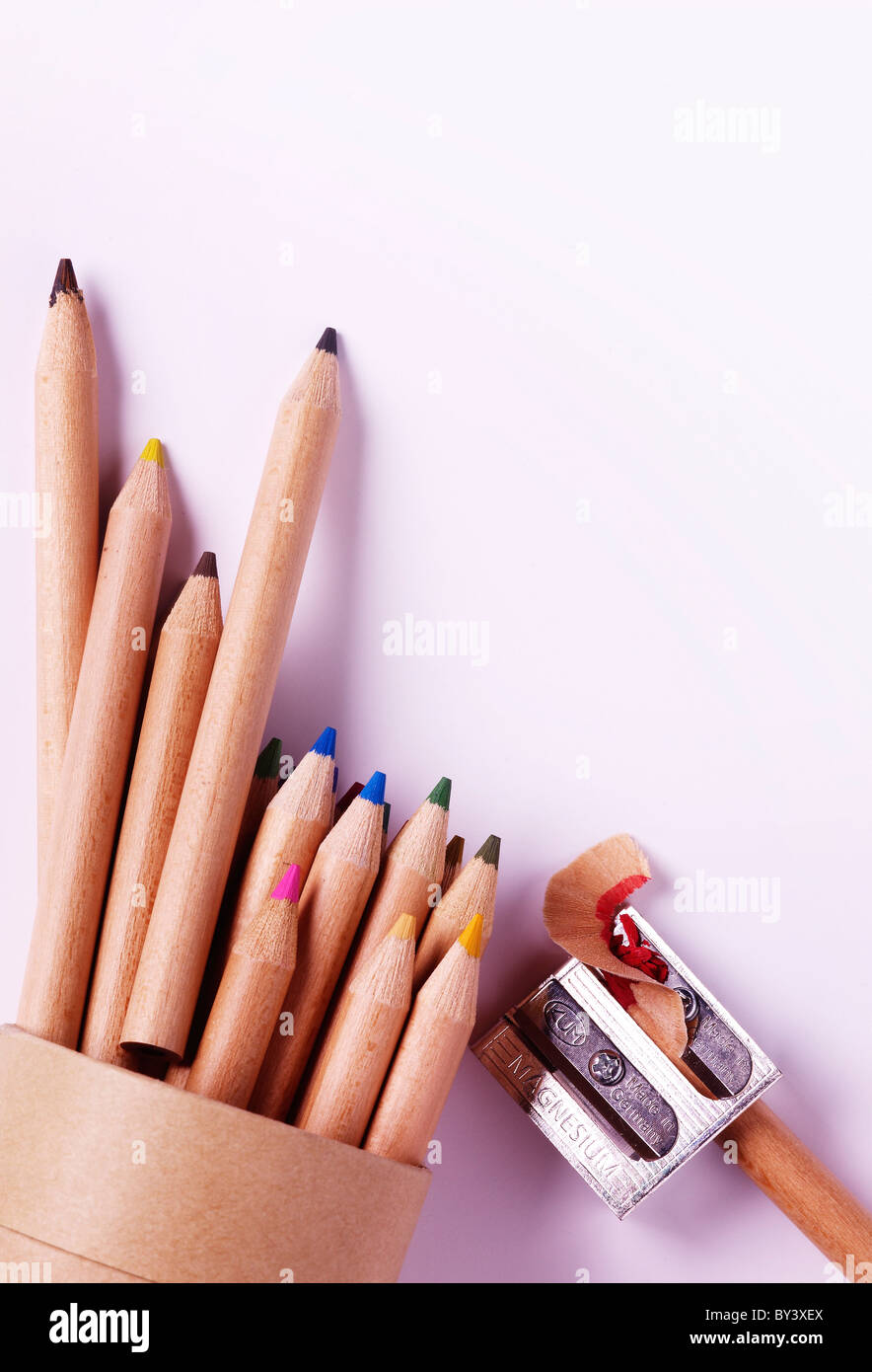 colour pencils coming out of a tube with a pencil sharpener Stock Photo ...