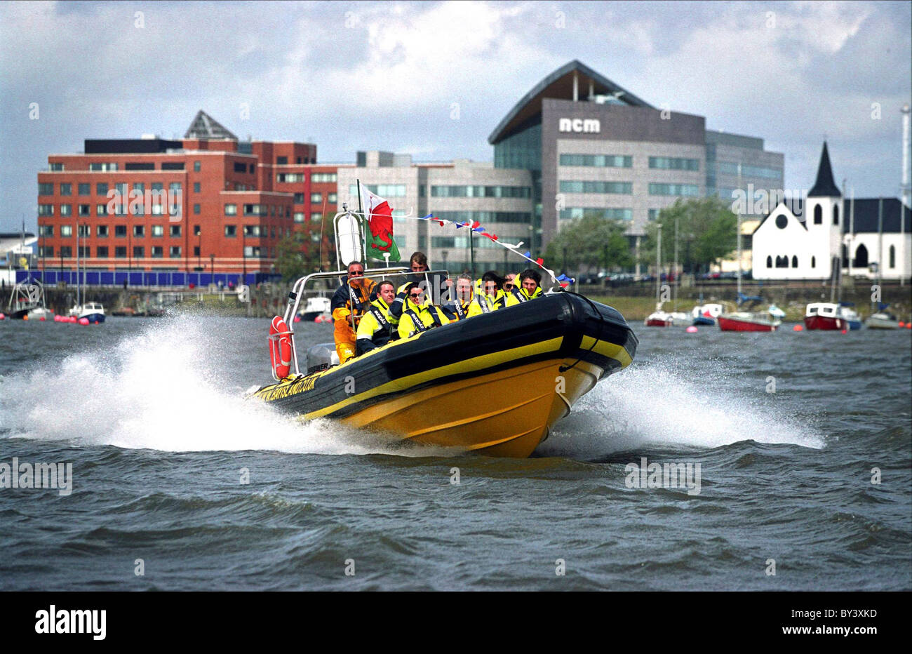 Tourists enjoying a speedboat ride in Cardiff Bay Stock Photo - Alamy