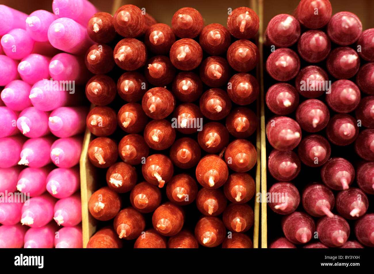 Colorful stack of candles on shelve in store Stock Photo - Alamy