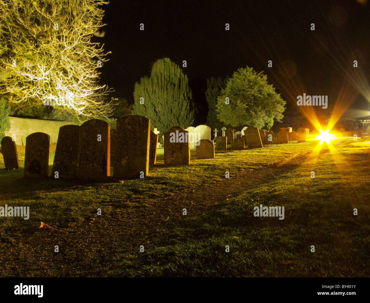 graveyard lit up at night time Stock Photo - Alamy