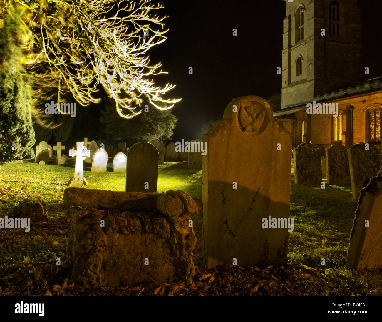 graveyard lit up at night time Stock Photo - Alamy