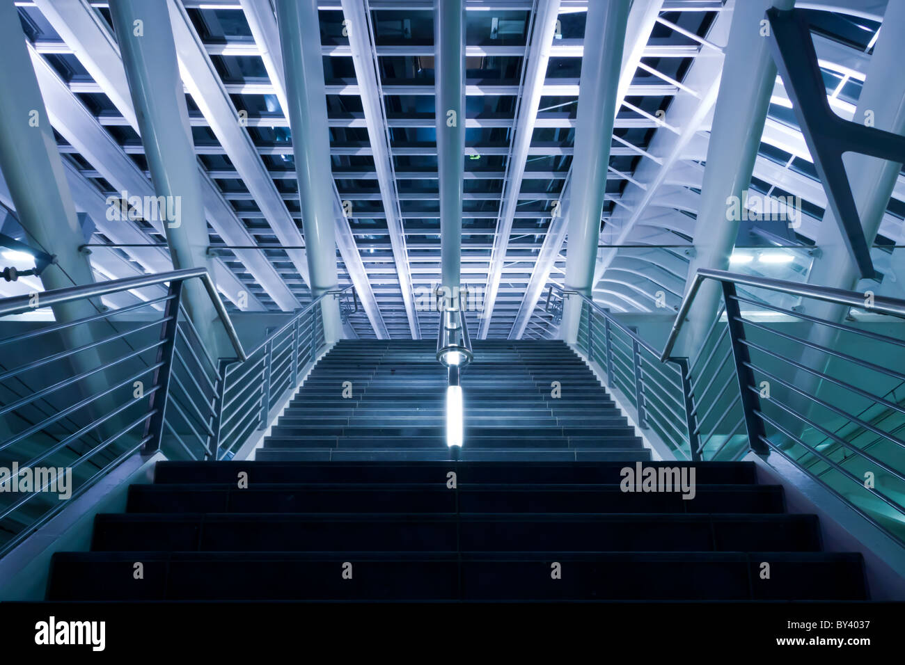 Futuristic modern architecture stairs with cold light and blue tint ...
