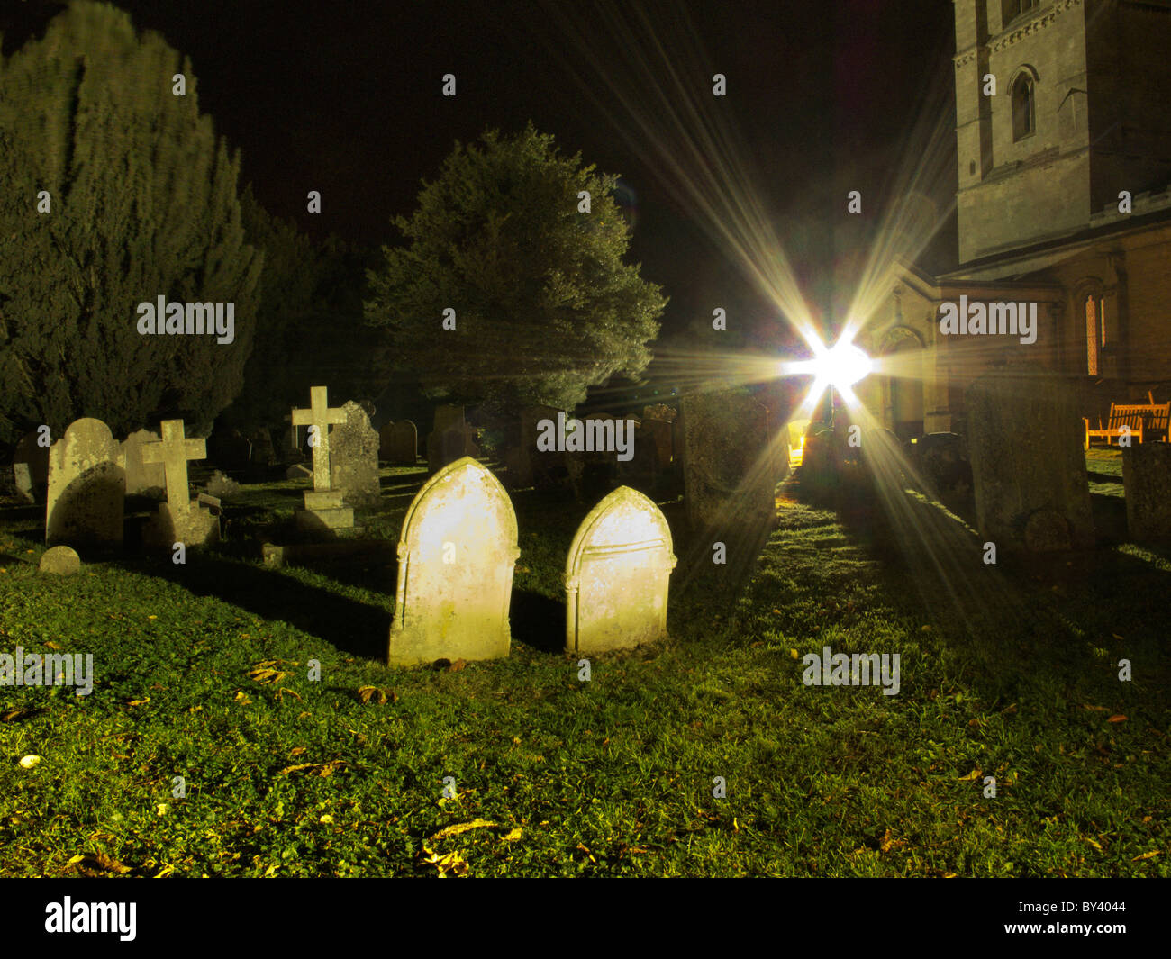 graveyard lit up at night time Stock Photo - Alamy