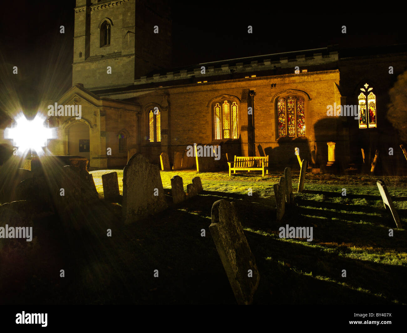 graveyard lit up at night time Stock Photo - Alamy