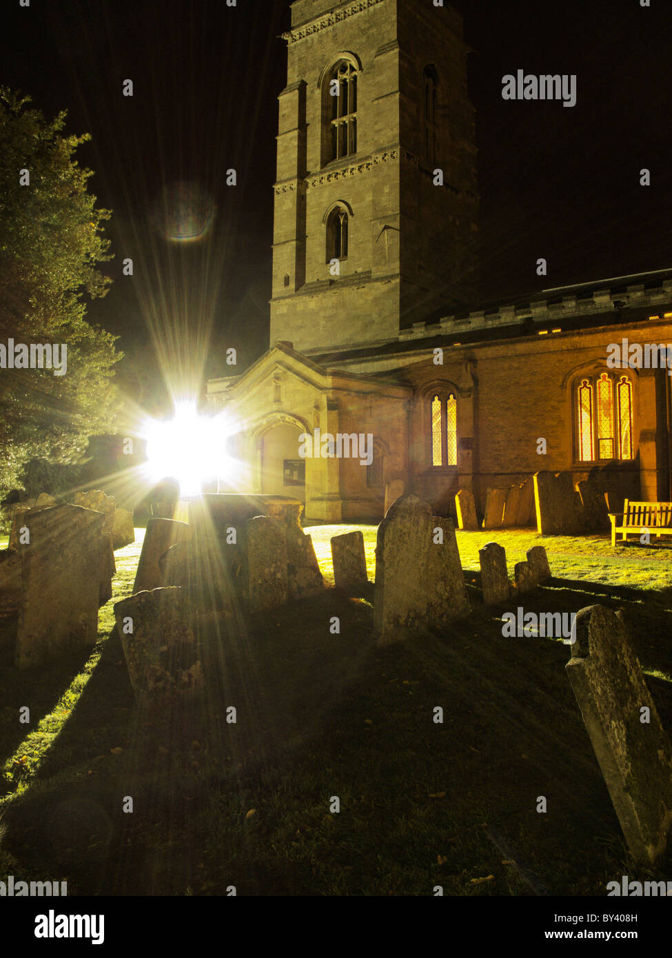 graveyard lit up at night time Stock Photo - Alamy