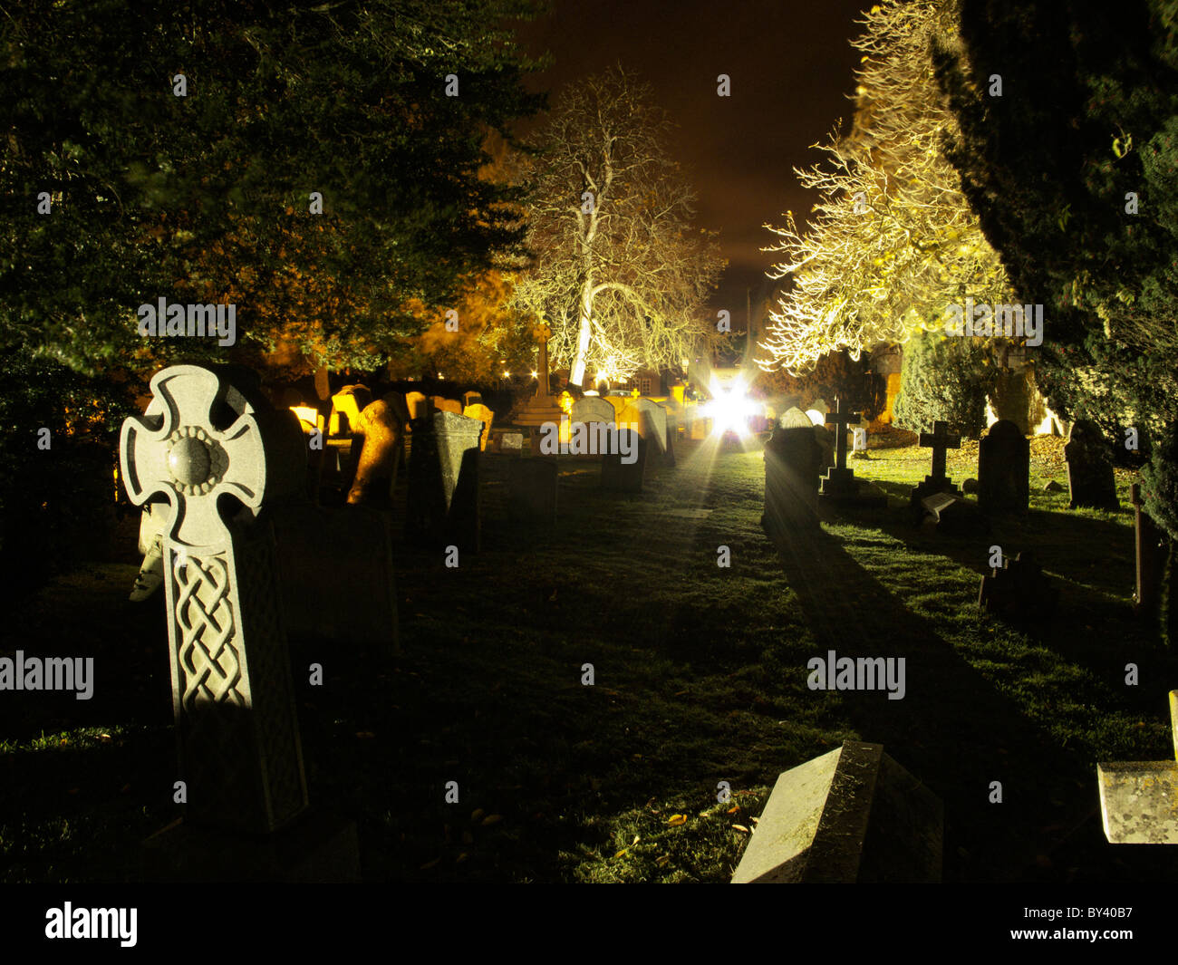 graveyard lit up at night time Stock Photo - Alamy