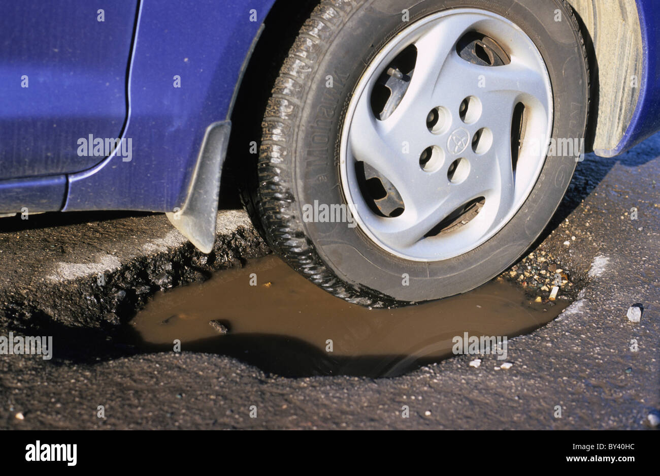 Big potholes on road hi-res stock photography and images - Alamy