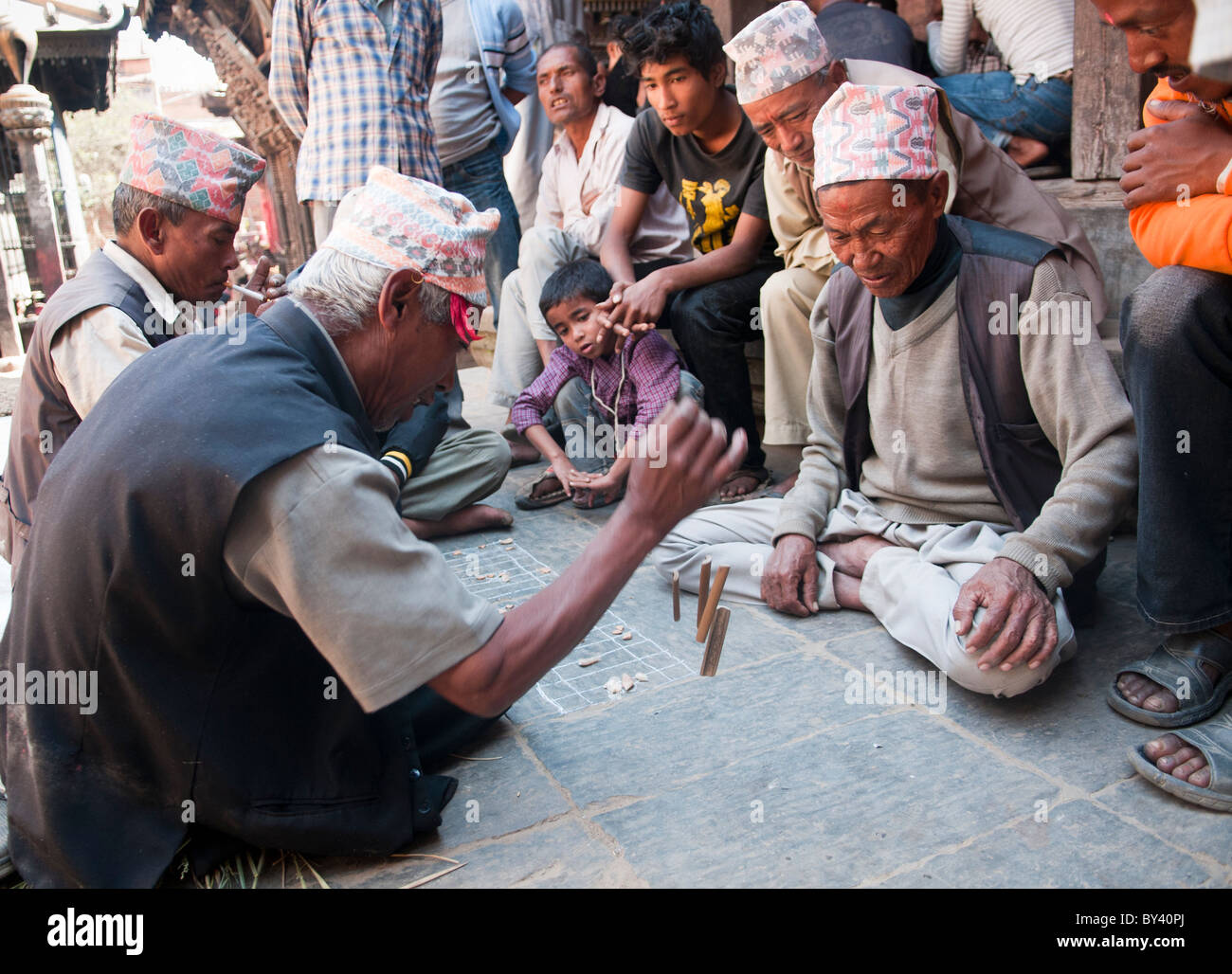 Nepali men playing games in ancient Bhaktapur, near Kathmandu, Nepal ...
