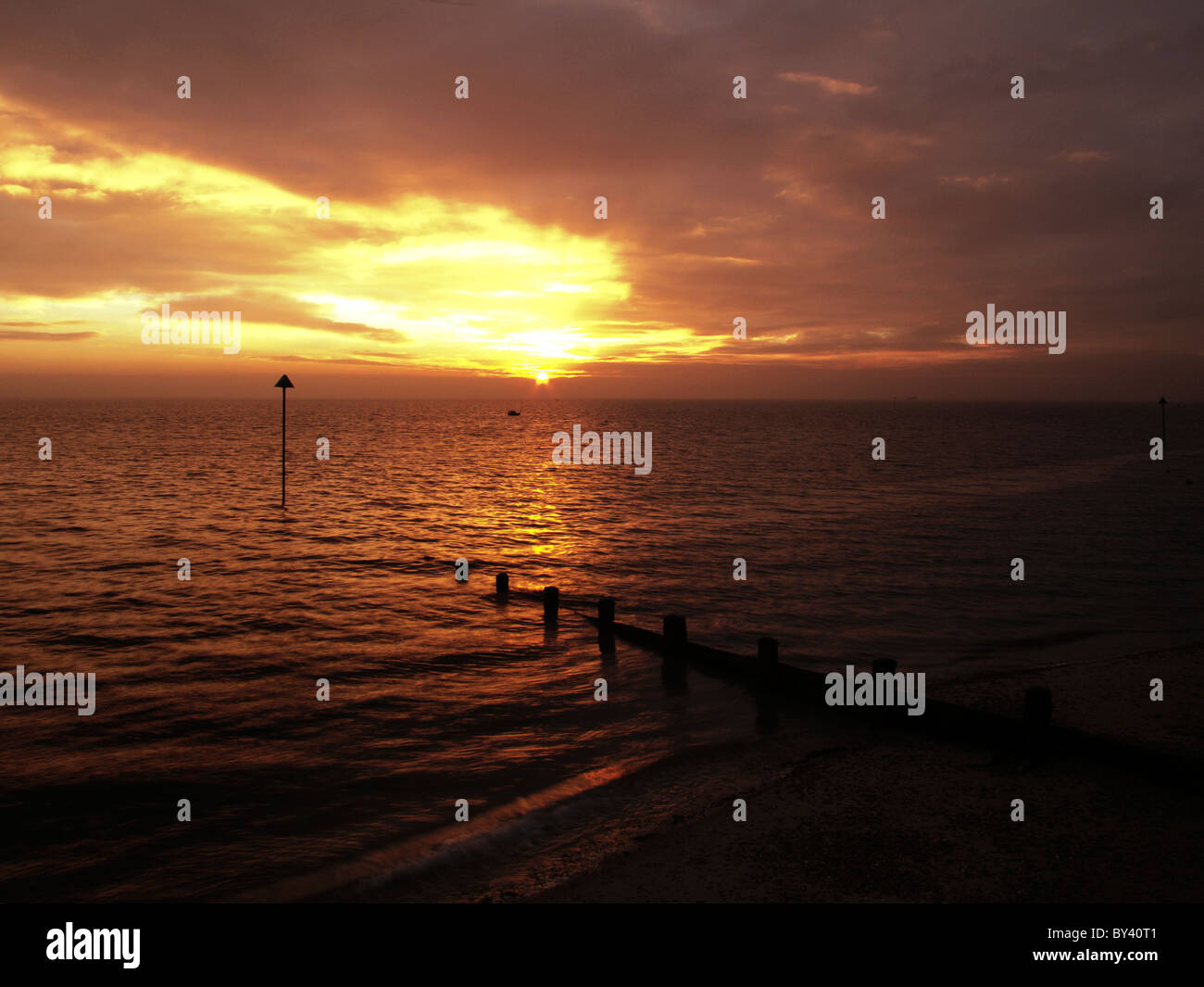 landscape image of south end on sea in essex england at sunset during ...
