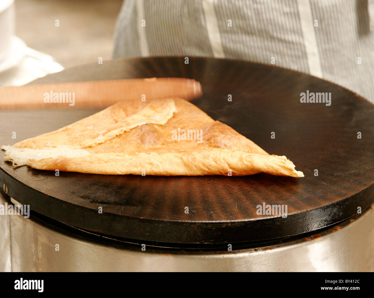Folding a pancake Stock Photo - Alamy