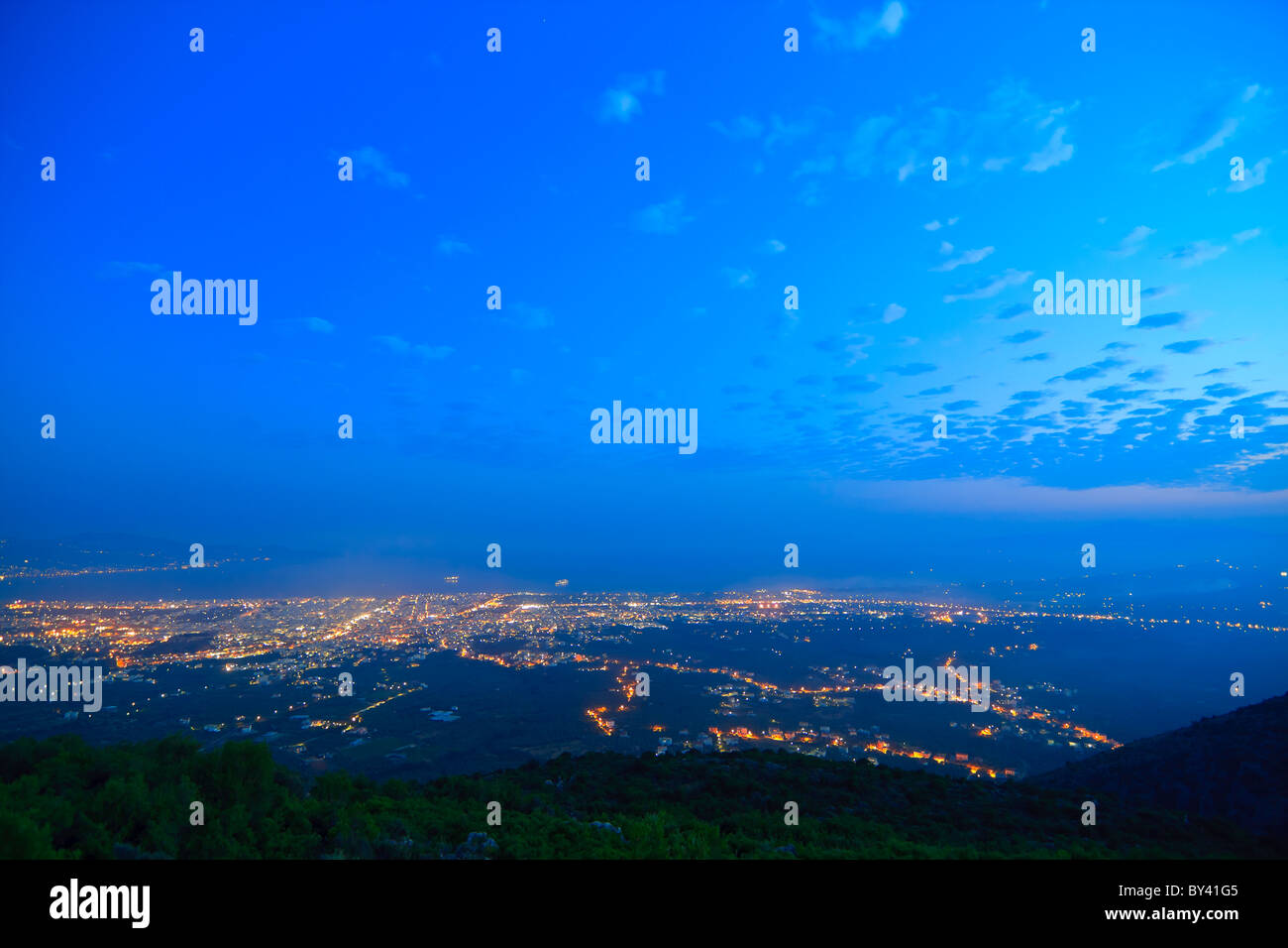 Greek city skyline at blue hour Stock Photo - Alamy