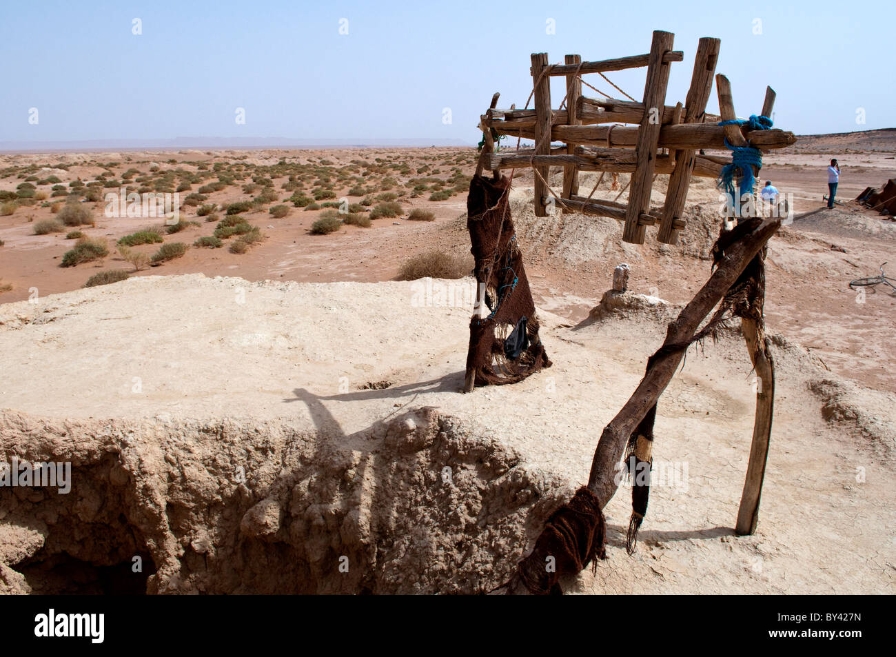 A desert well and bucket raising mechanism in the Sahara Desert near ...