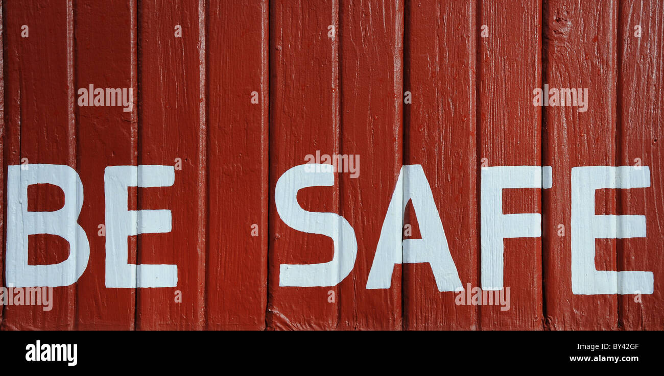 Be safe sign on a wall outside Stock Photo - Alamy