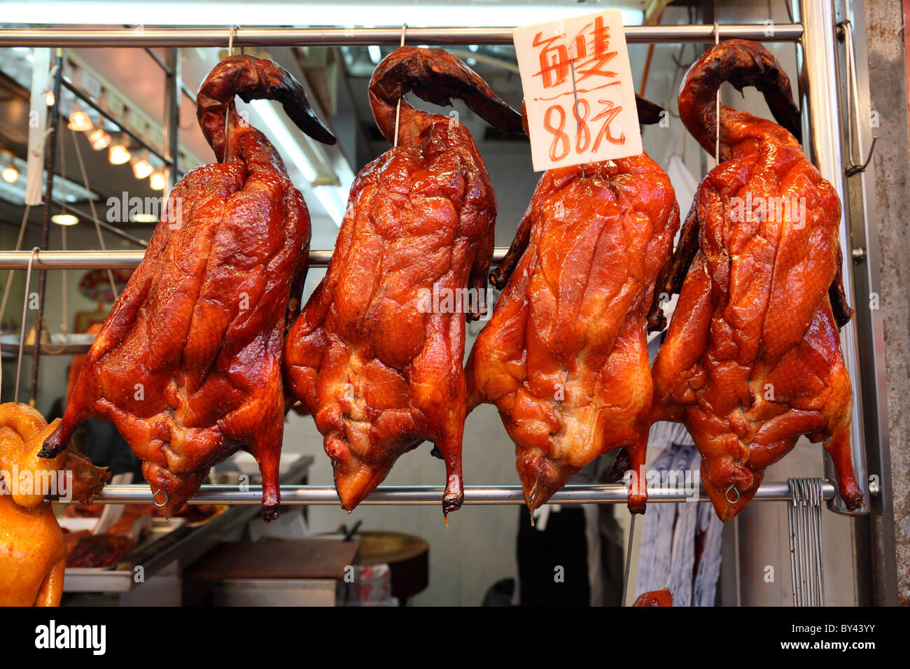 Roasted ducks hanging in window hi-res stock photography and images - Alamy