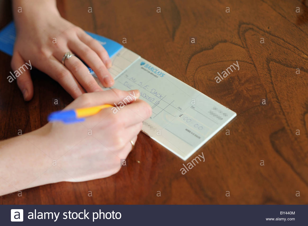 Chequebook High Resolution Stock Photography and Images - Alamy