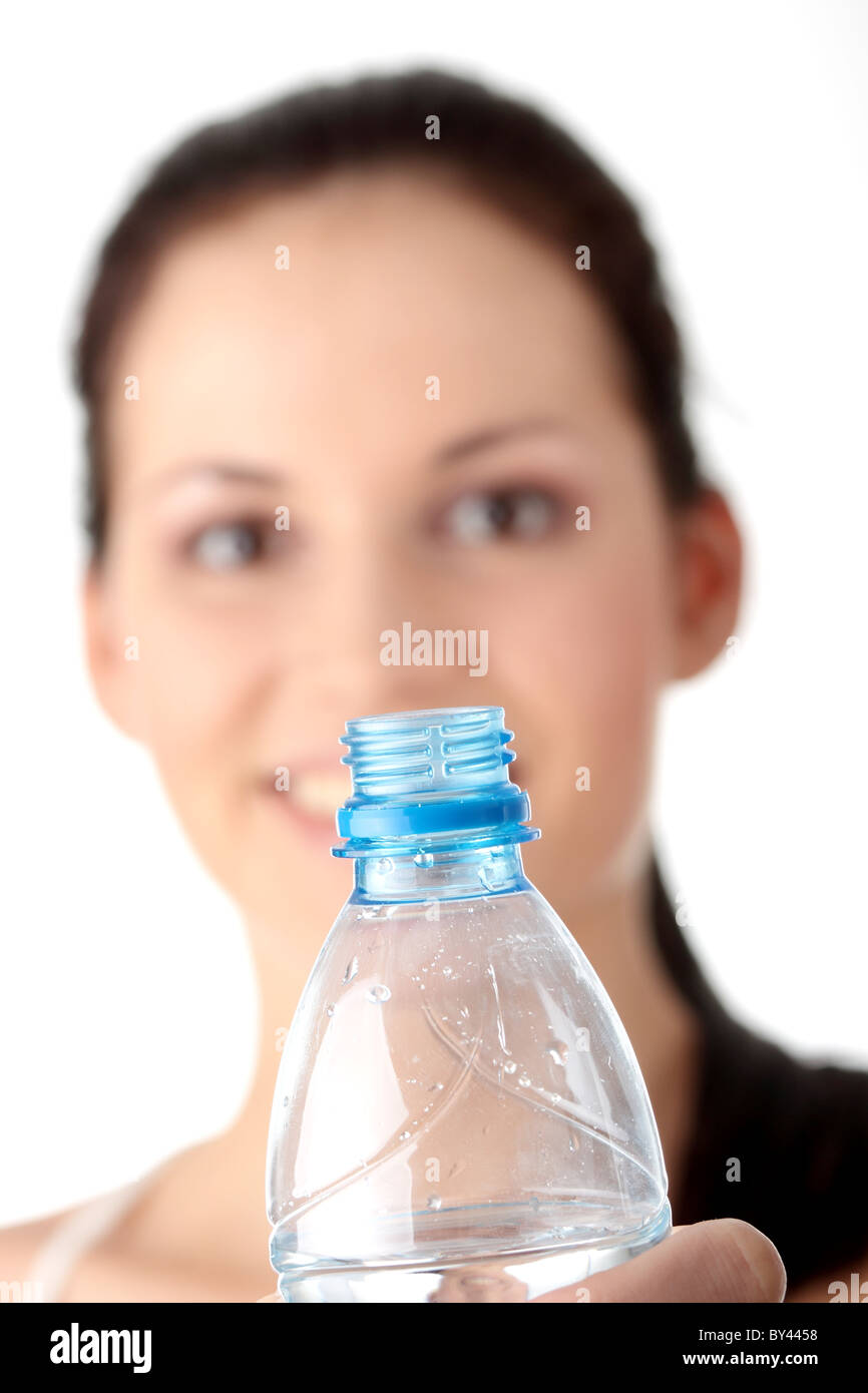 Young woman drinking water from plactic bottle Stock Photo - Alamy